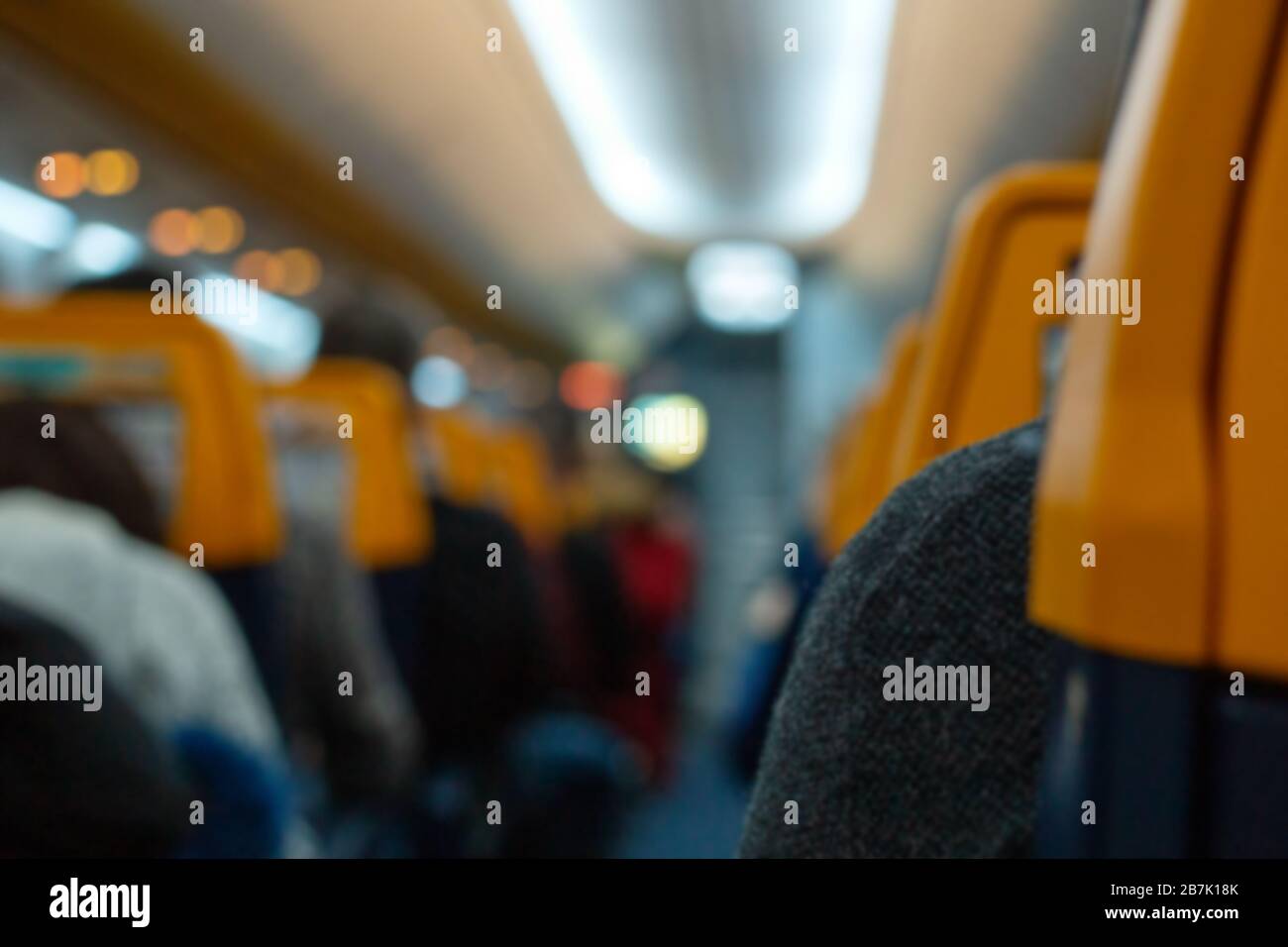 Airplane Interior with passengers. Airplane cabin is full of passengers ...