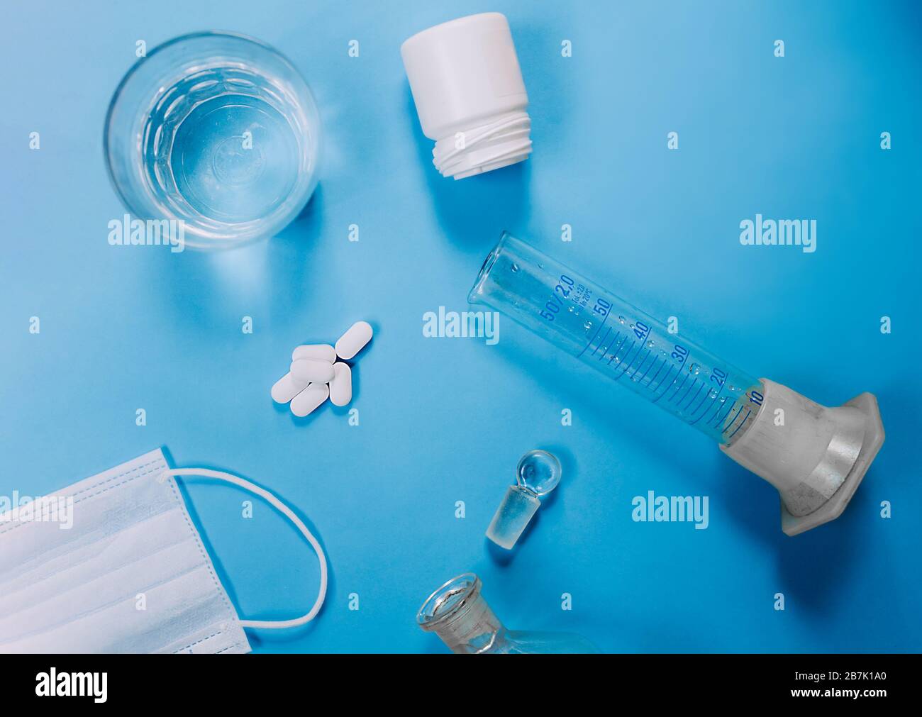 handful of large white capsules with tablets on the background of ...