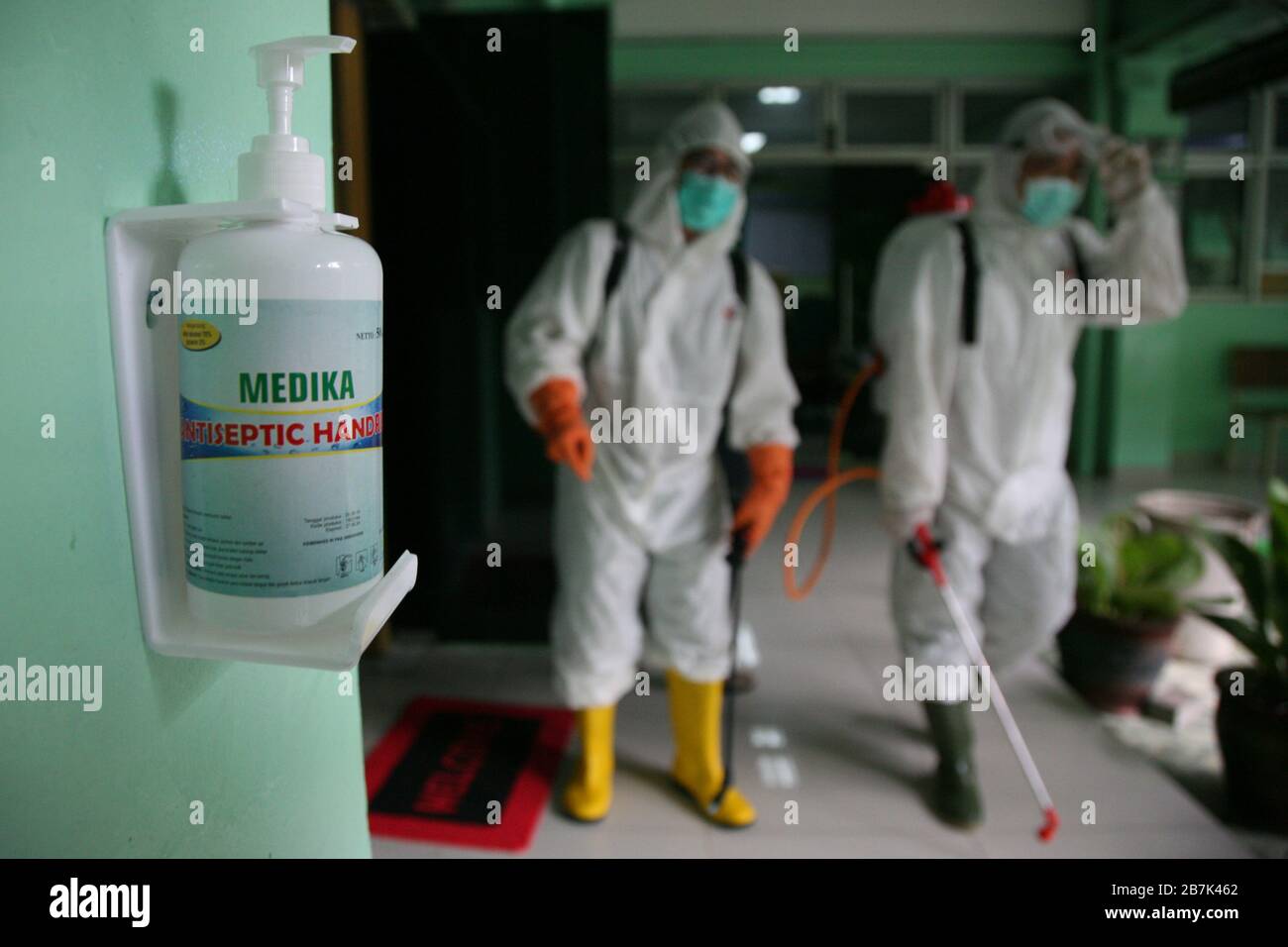 Officers spray disinfectant hi-res stock photography and images - Alamy