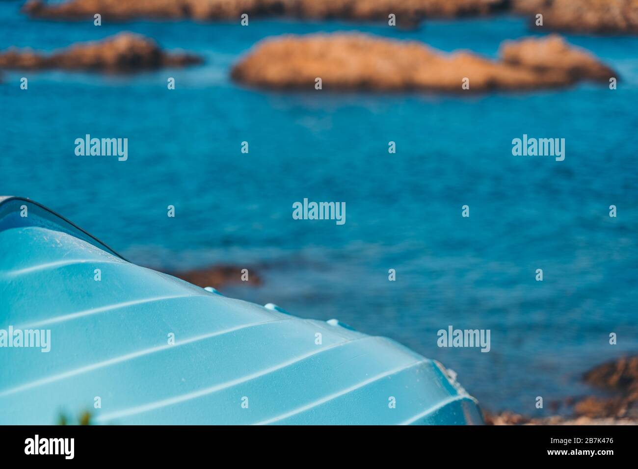 Blue Rowboat on beach; natural background Stock Photo - Alamy