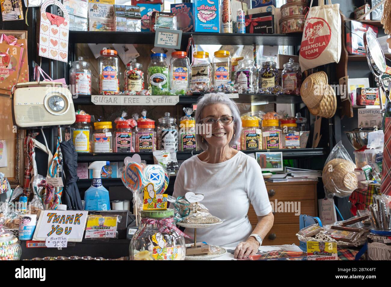 Shop Lady in her Sweet Shop Stock Photo - Alamy