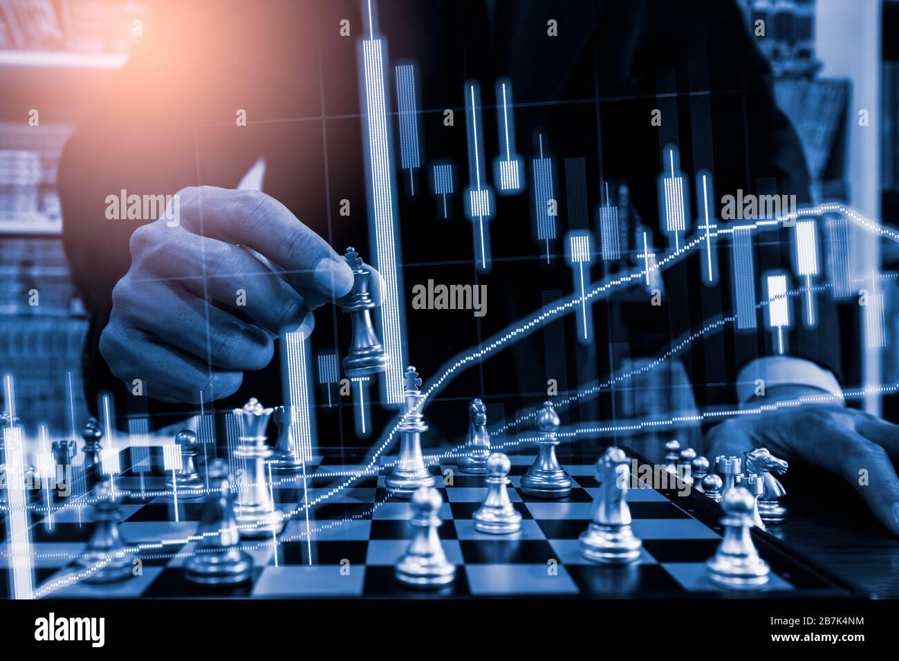 Chess game on chess board on stock market or forex trading graph chart ...