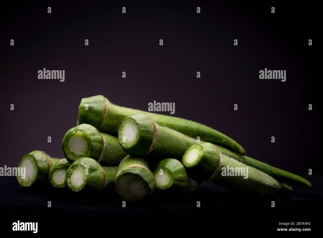 Lot of Okra or Ladies' fingers vegetable in graphic moody frame. Studio ...