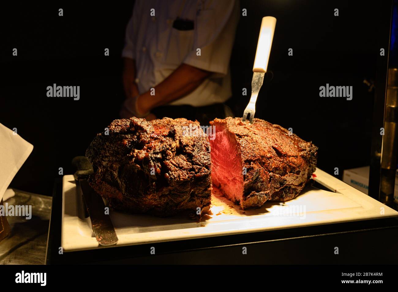 Large Roast on Serving Table waiting to be sliced at a reception Stock ...