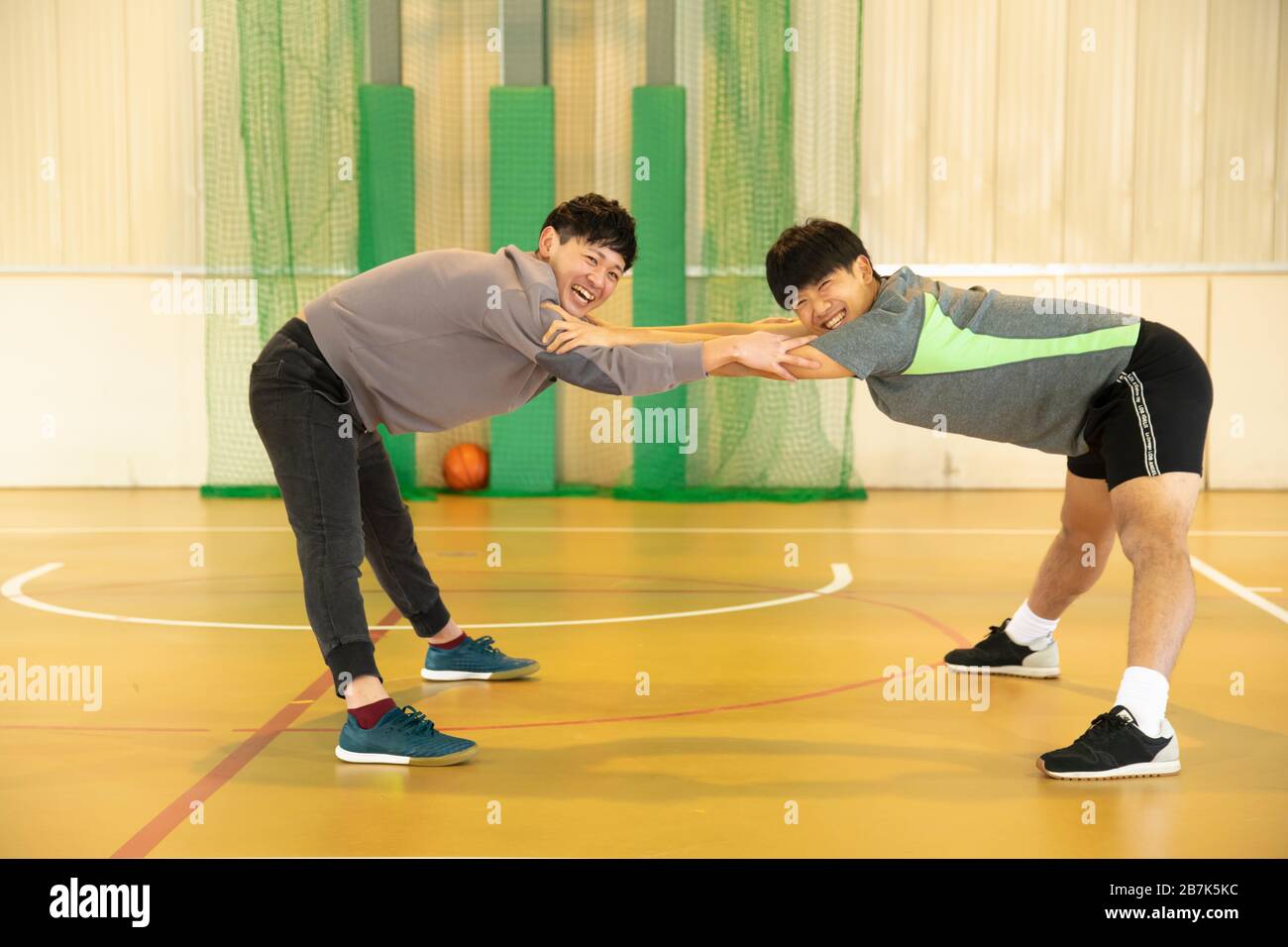 Young people stretching Stock Photo - Alamy
