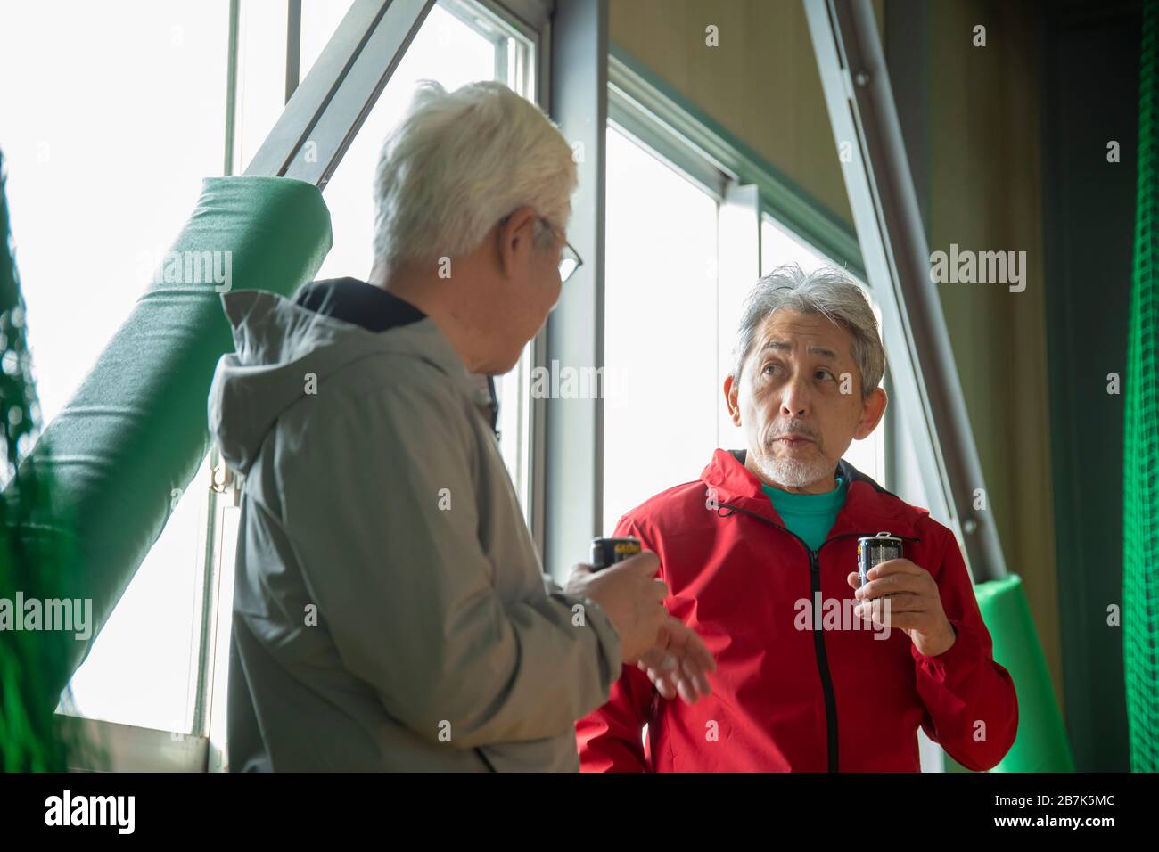 Senior man talking with smile Stock Photo - Alamy