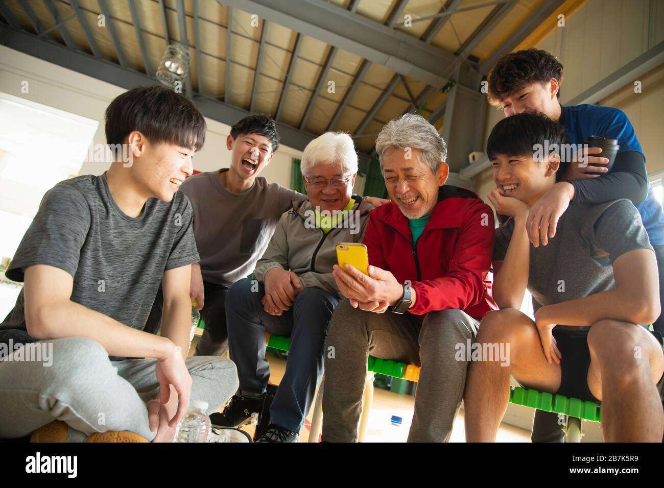 Senior and young people talking with smile Stock Photo - Alamy