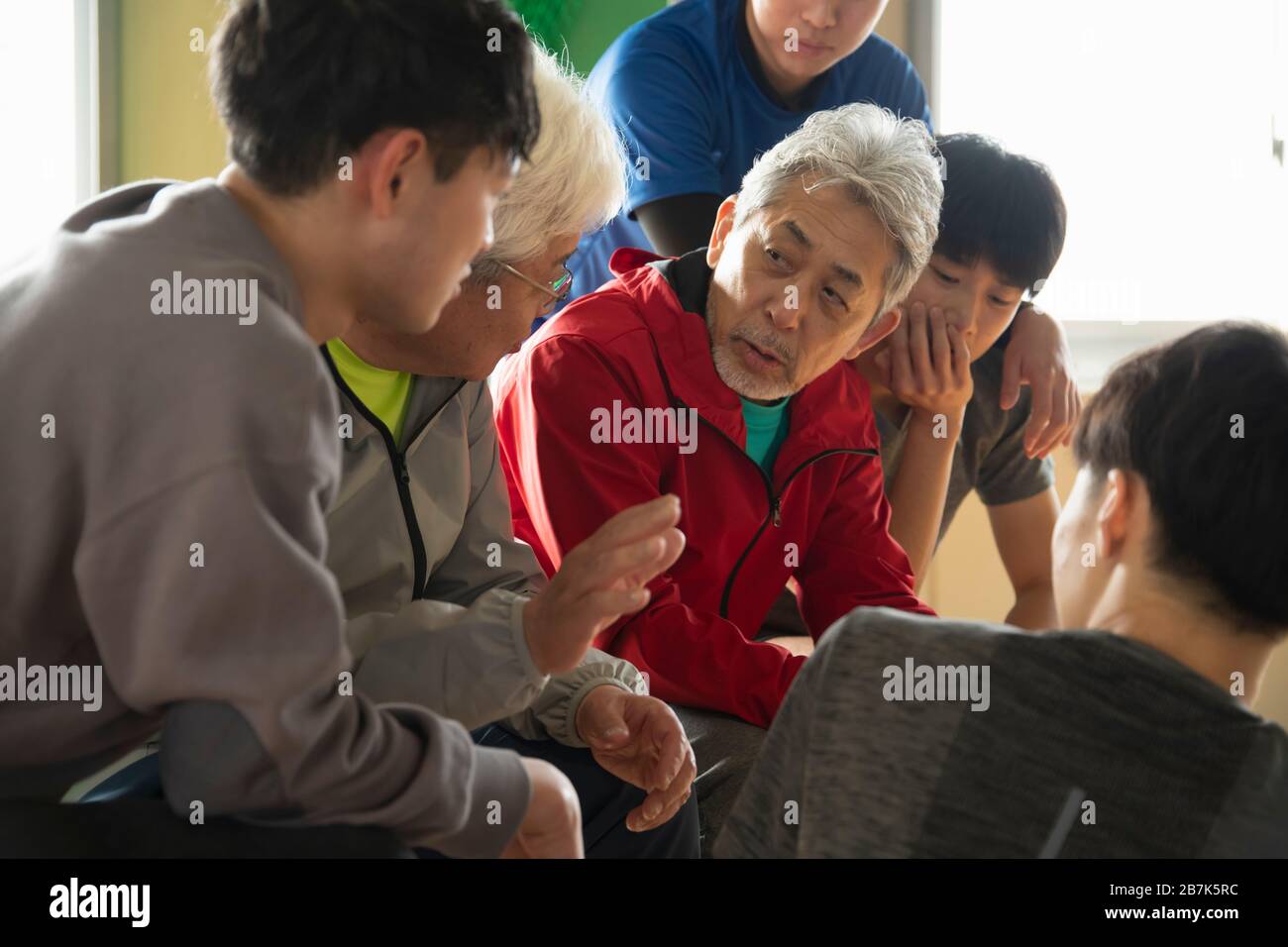 Senior and young people talking with smile Stock Photo - Alamy