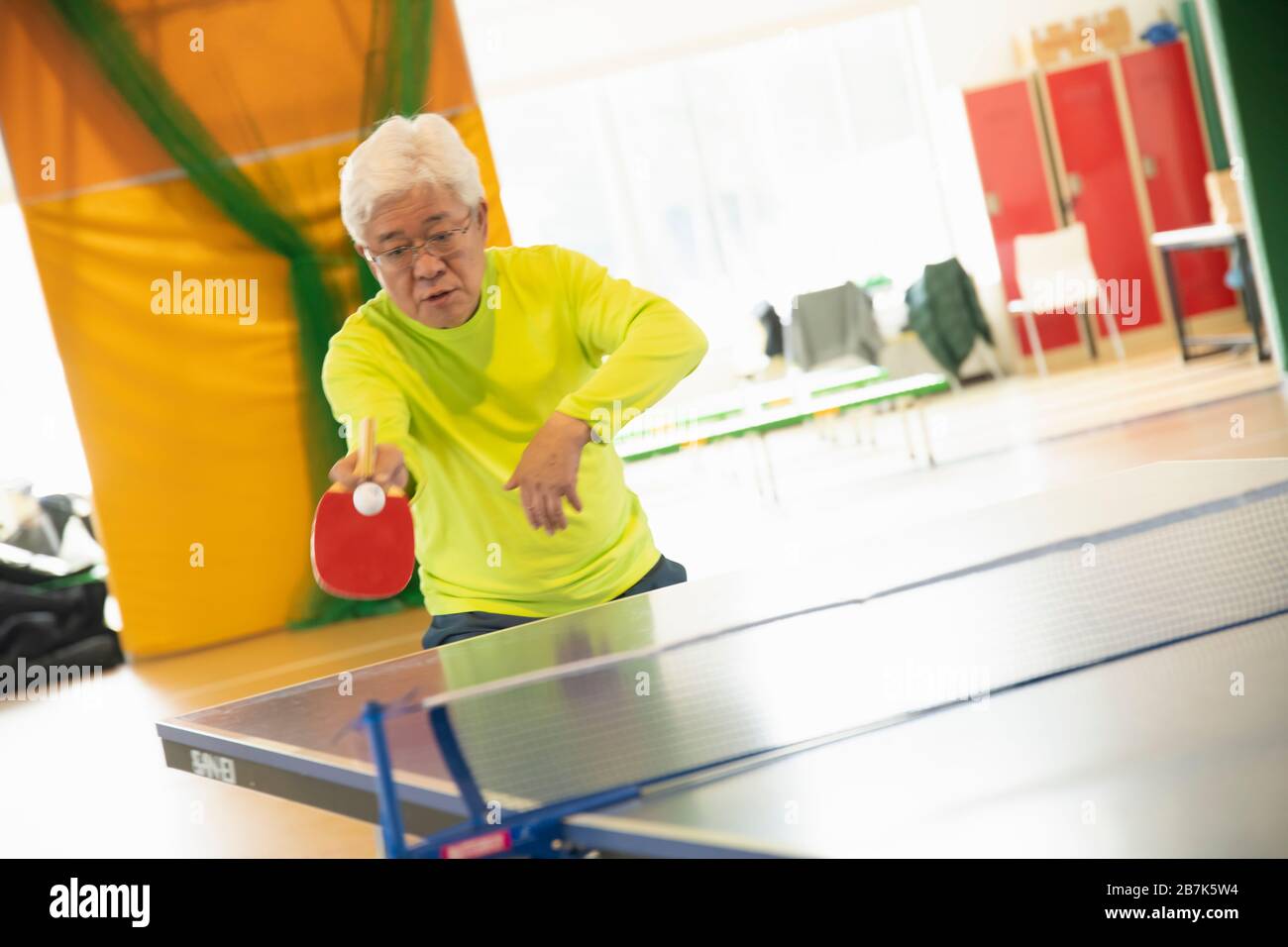 Senior man enjoying table tennis Stock Photo - Alamy