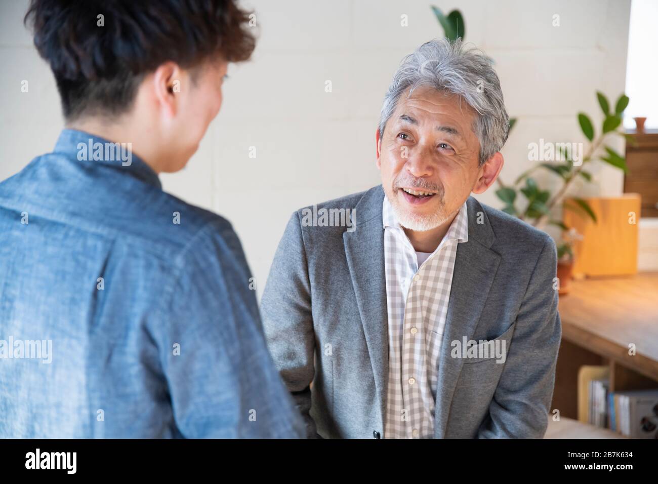 Young man scolded by boss Stock Photo - Alamy