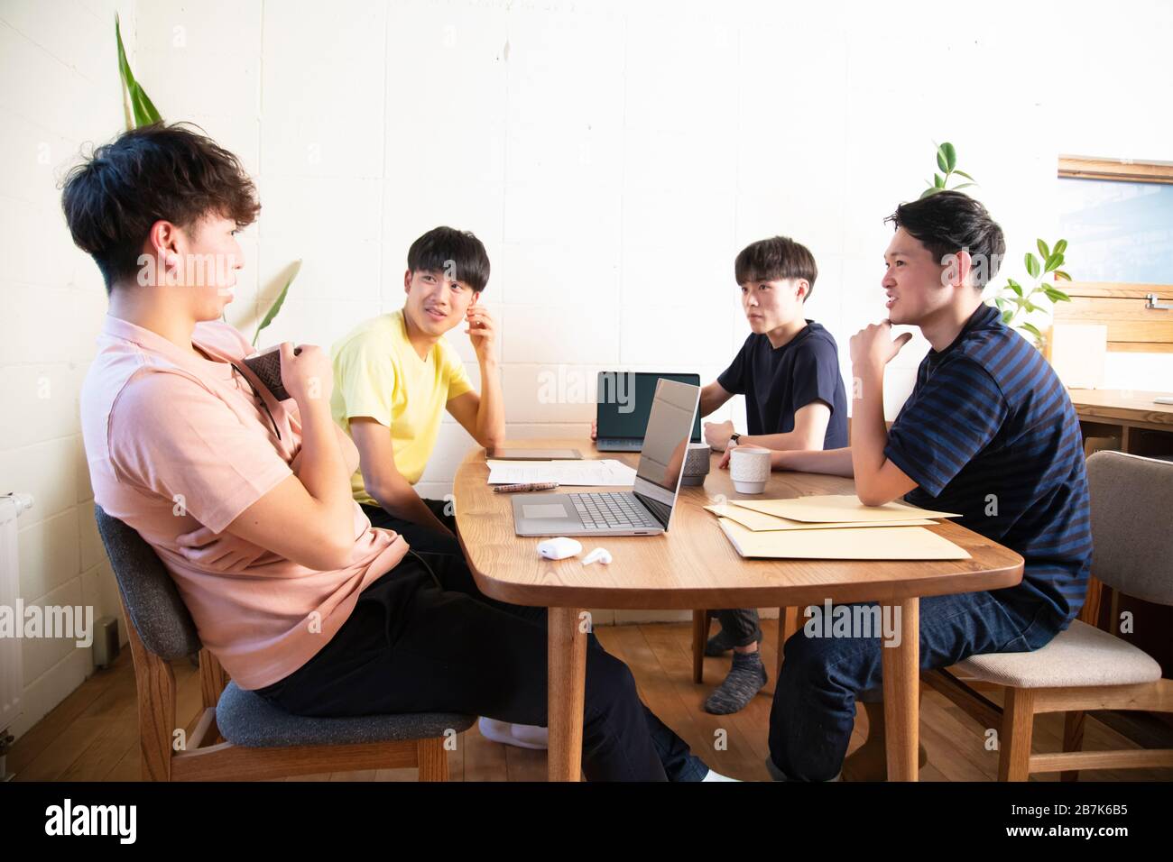 Young people teleworking Stock Photo - Alamy