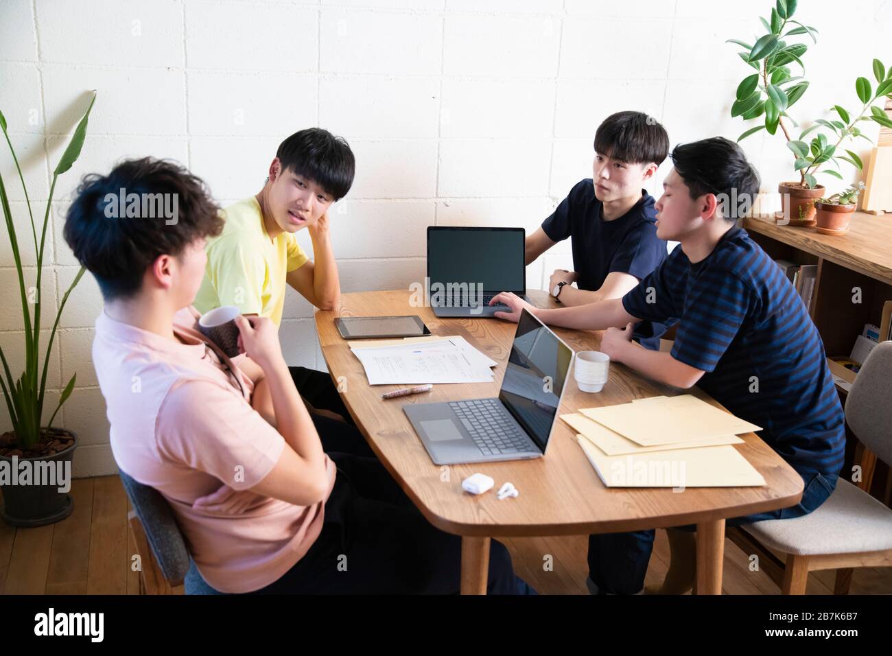 Young people teleworking Stock Photo - Alamy