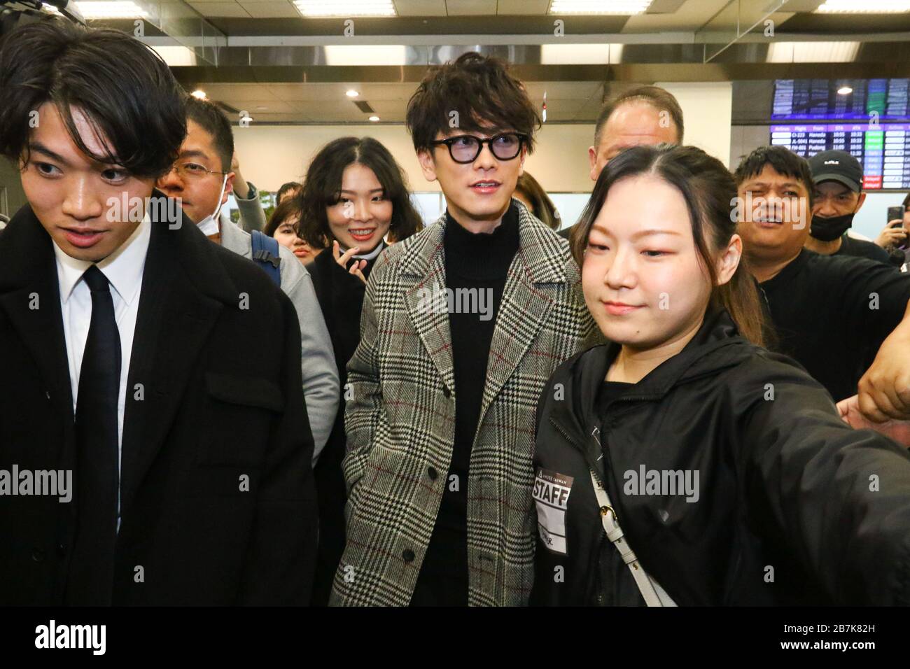 Japanese actor Takeru Satoh, middle, arrives at the Taiwan Taoyuan ...