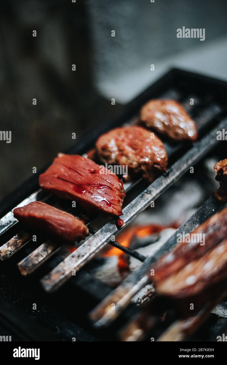 raw meat on a barbecue grill Stock Photo - Alamy