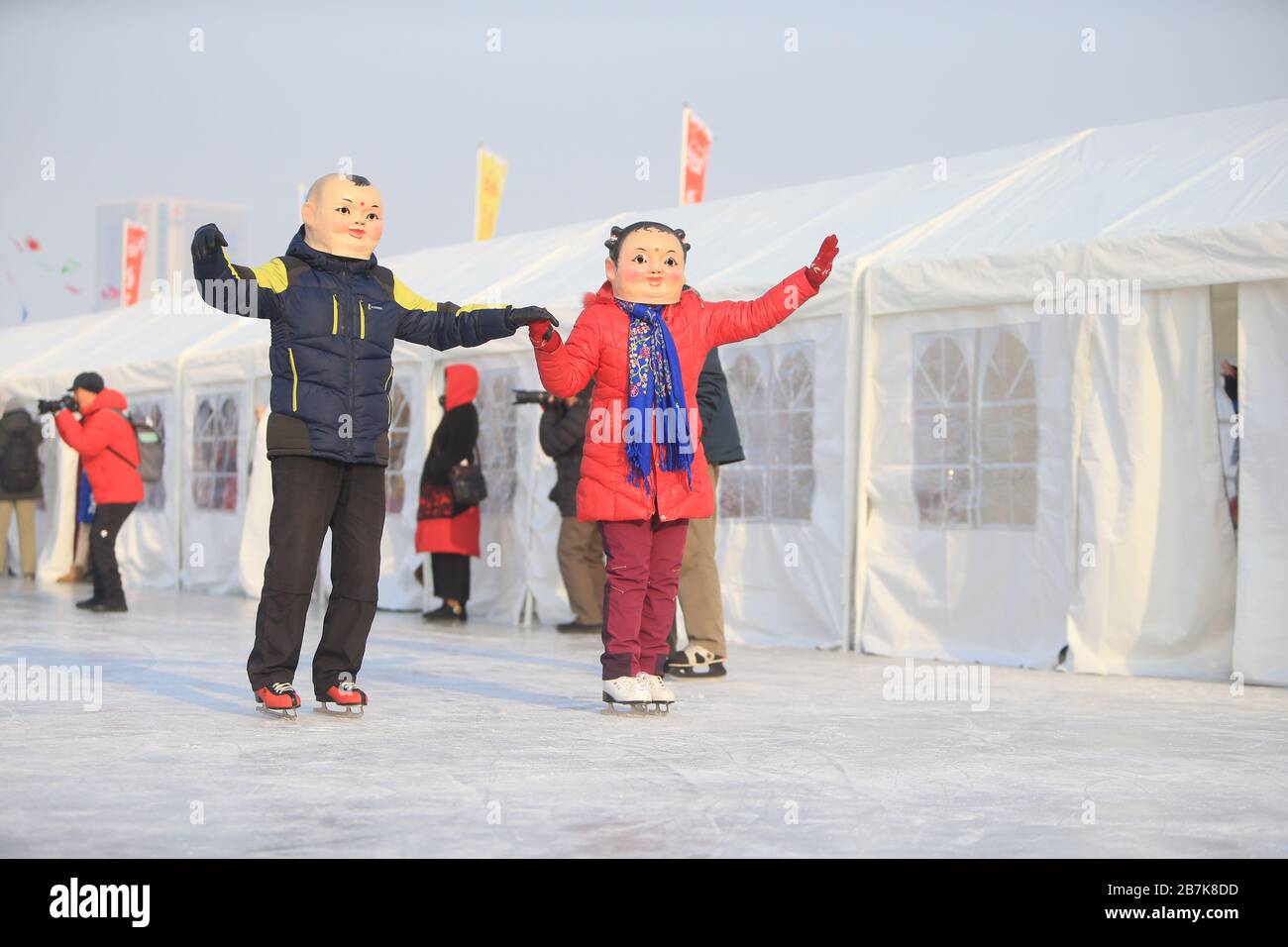 People dressed up in customes perform while skating on ice at Hunhe ...