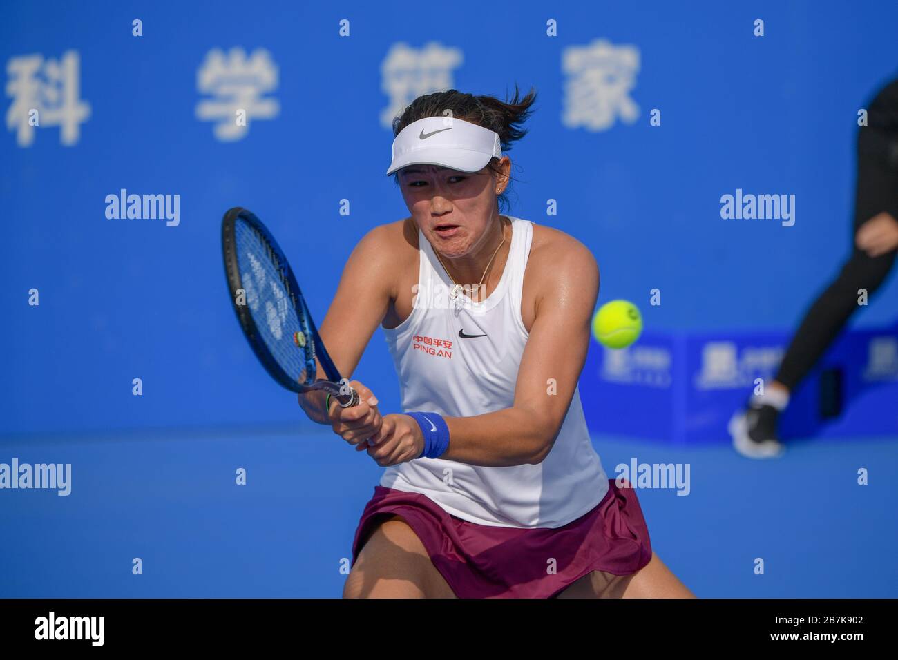 Chinese professional tennis player Wang Xiyu competes against Romanian ...