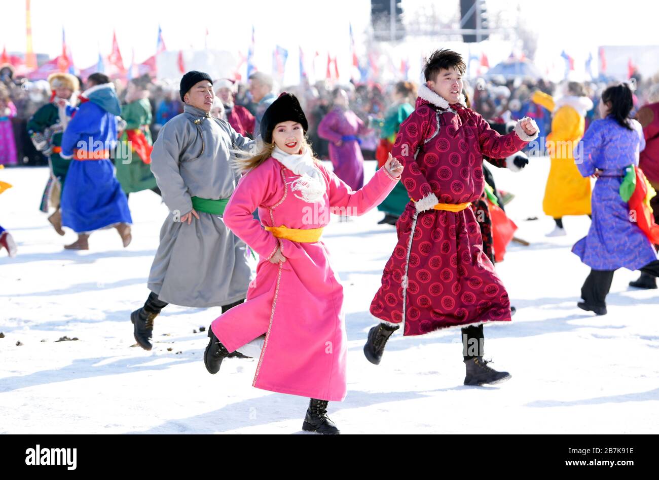 People dance at the opening ceremony of the 13th Dalinur River Winter ...