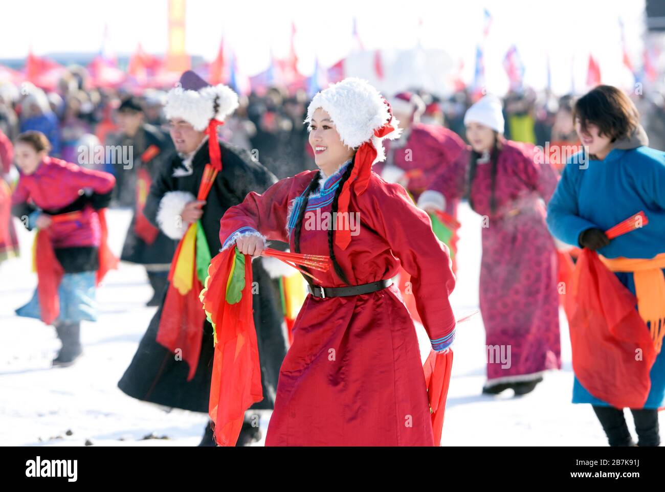 People dance at the opening ceremony of the 13th Dalinur River Winter ...