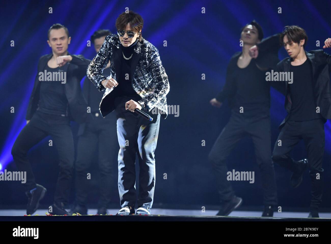 Taiwanese singer, actor and host Show Lo, middle, dances on the stage ...