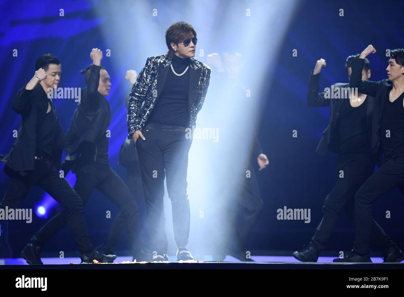 Taiwanese singer, actor and host Show Lo, middle, dances on the stage ...