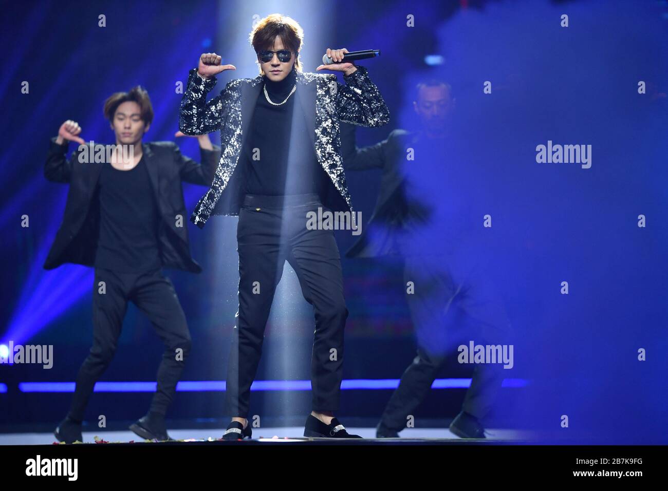 Taiwanese singer, actor and host Show Lo, middle, dances on the stage ...