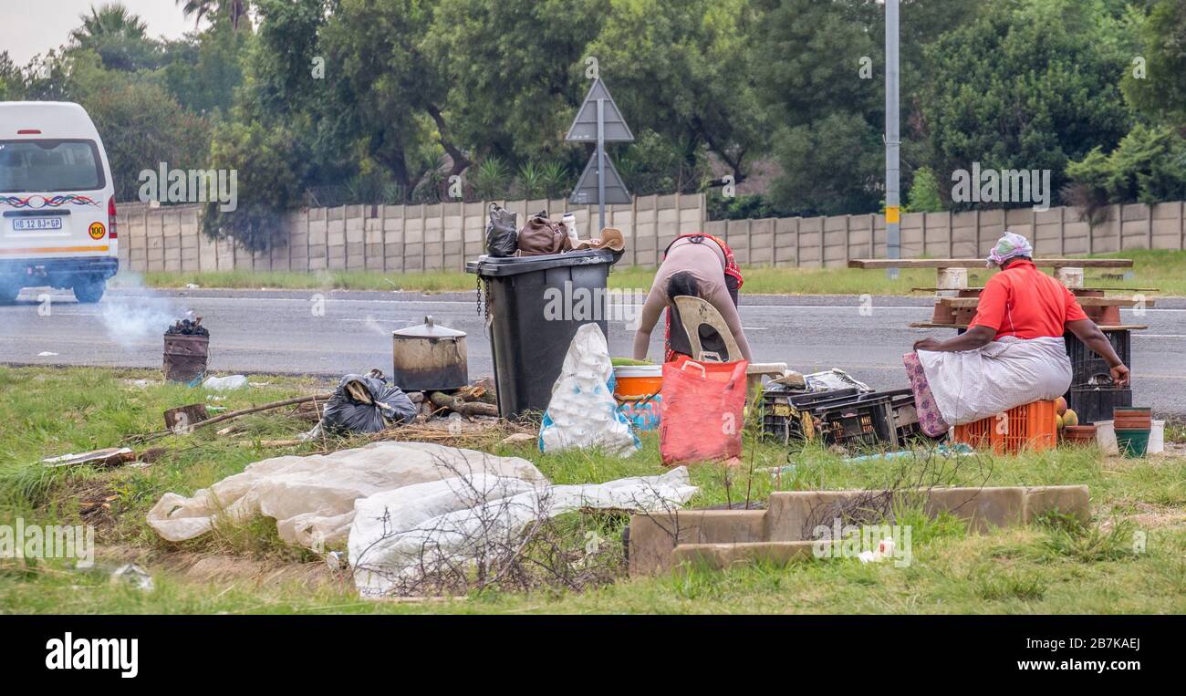 Alberton, South Africa - two black African women operate a makeshift ...