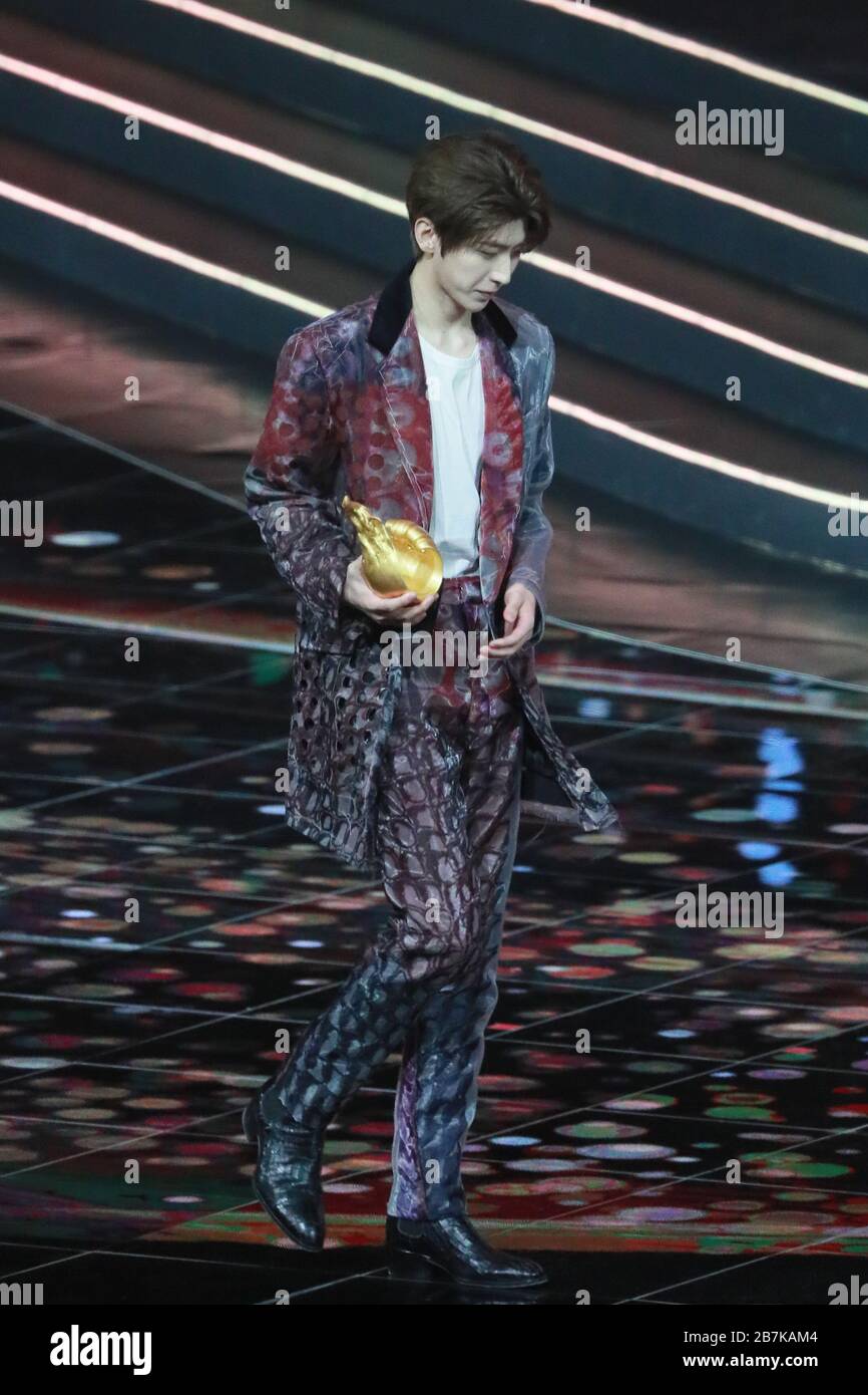 Chinese singer, dancer, rapper, and songwriter Cai Xukun or Kun holds ...