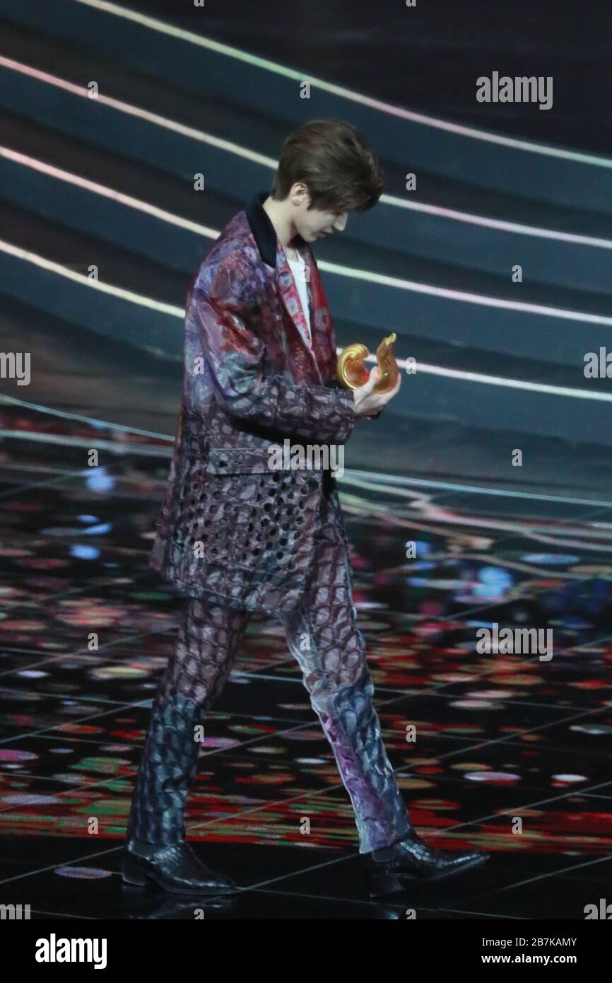 Chinese singer, dancer, rapper, and songwriter Cai Xukun or Kun holds ...