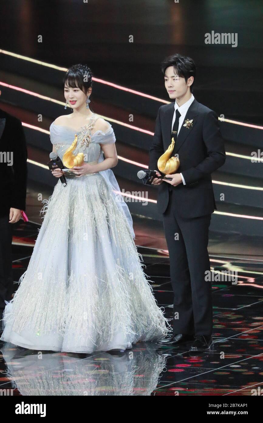 Chinese actress Yang Zi or Andy Yang, left, holds an award at the Weibo ...