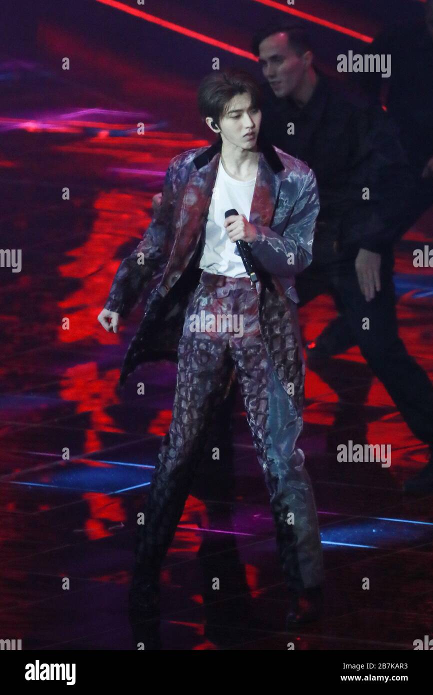 Chinese singer, dancer, rapper, and songwriter Cai Xukun or Kun holds ...