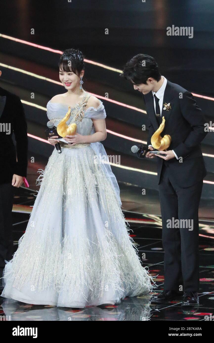 Chinese actress Yang Zi or Andy Yang, left, holds an award at the Weibo ...
