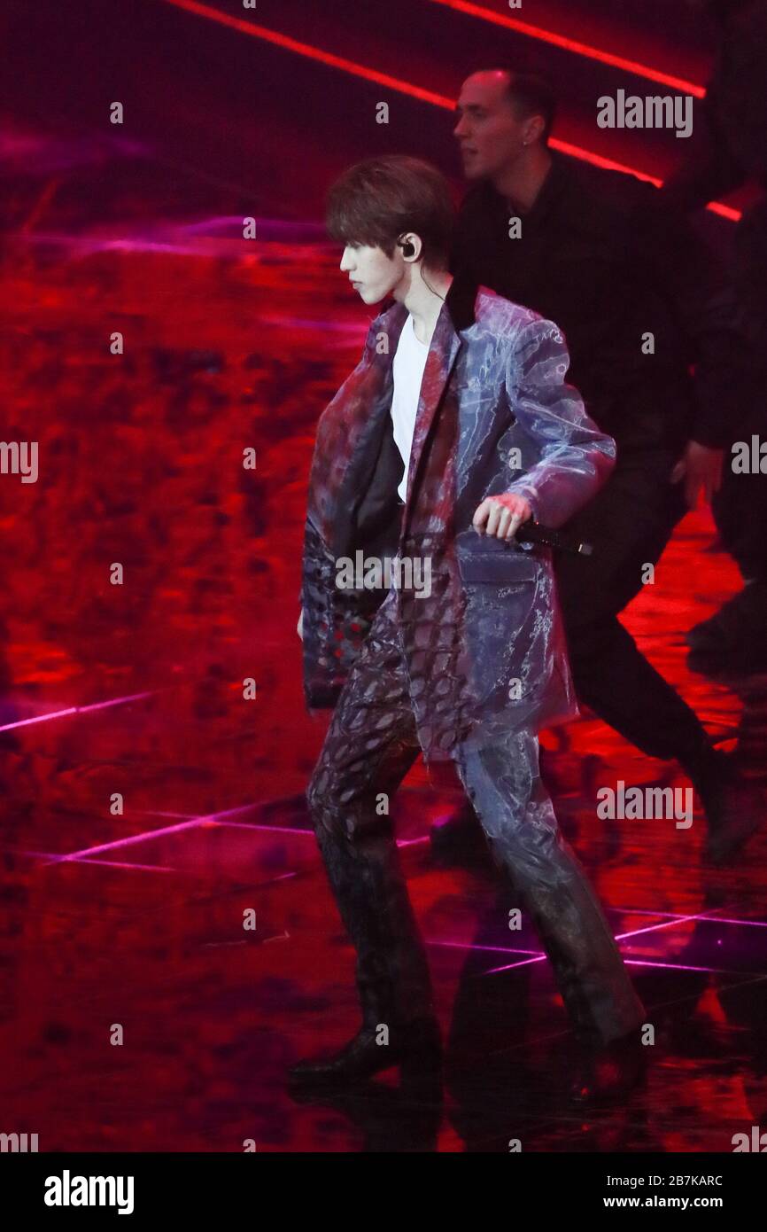 Chinese singer, dancer, rapper, and songwriter Cai Xukun or Kun holds ...