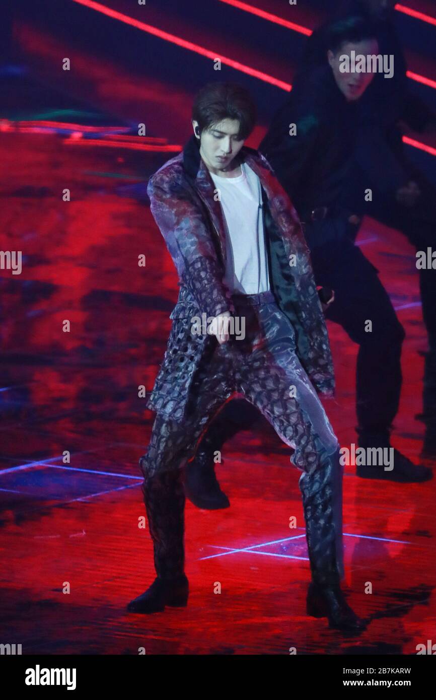 Chinese singer, dancer, rapper, and songwriter Cai Xukun or Kun holds ...