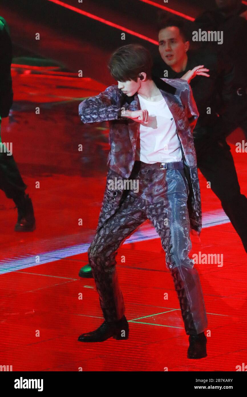 Chinese singer, dancer, rapper, and songwriter Cai Xukun or Kun holds ...