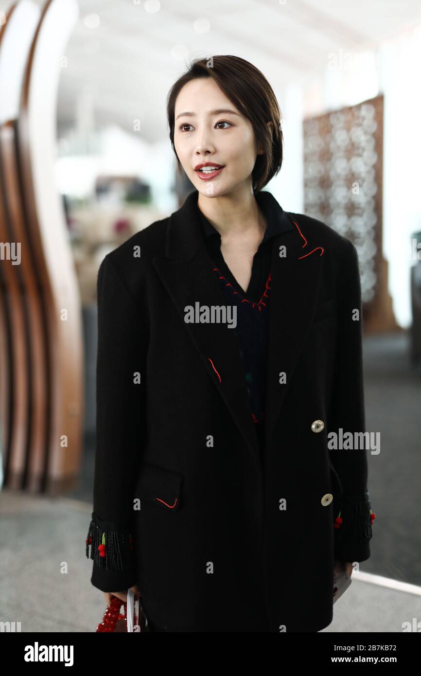 Chinese actress Li Chun arrives at a Beijing airport before departure ...