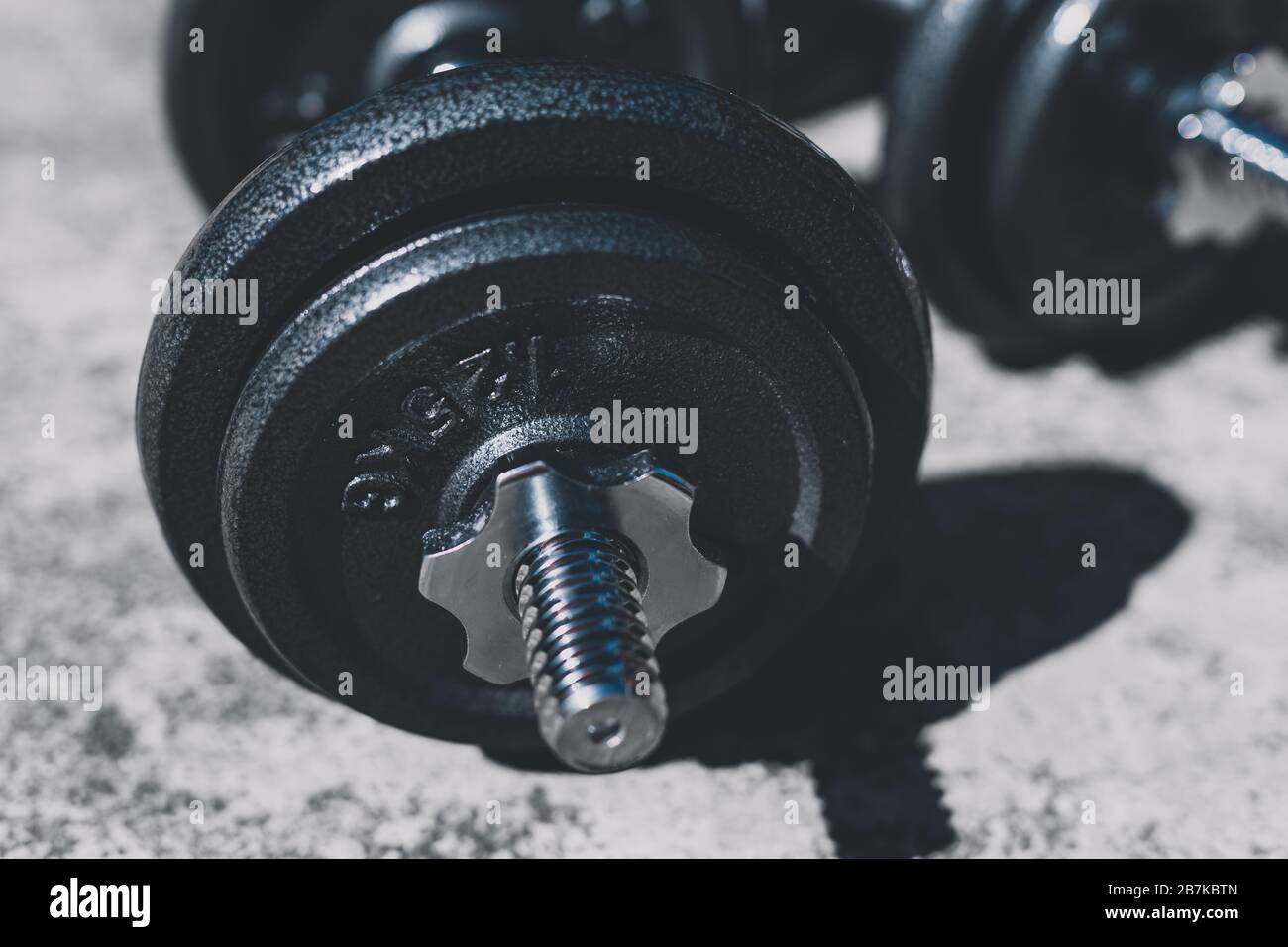keeping fit and exercising outdoor or at home, set of heavy dumbbells ...