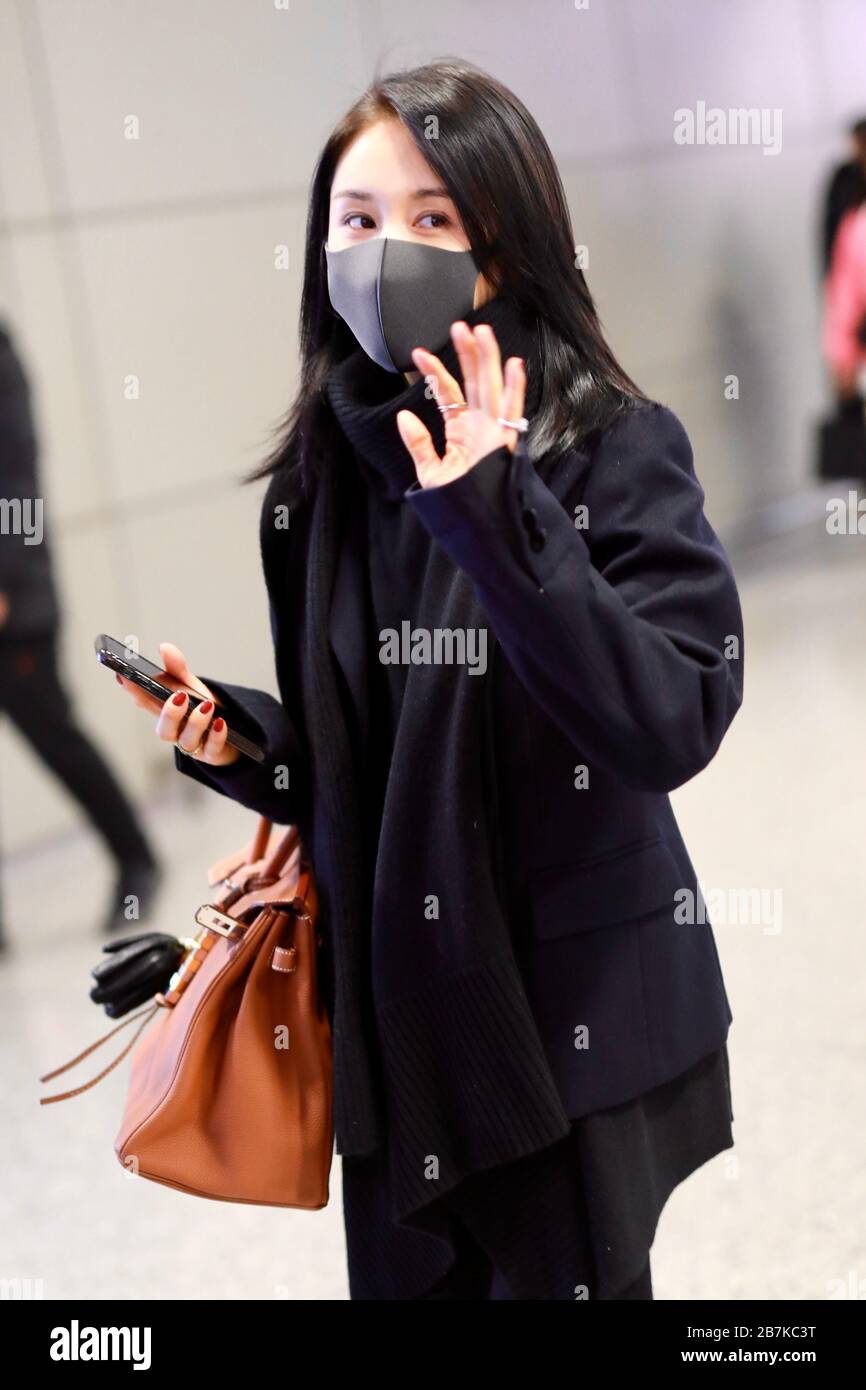 Chinese actress Wang Ziwen or Olivia Wang arrives at a Chengdu airport before departure in ...