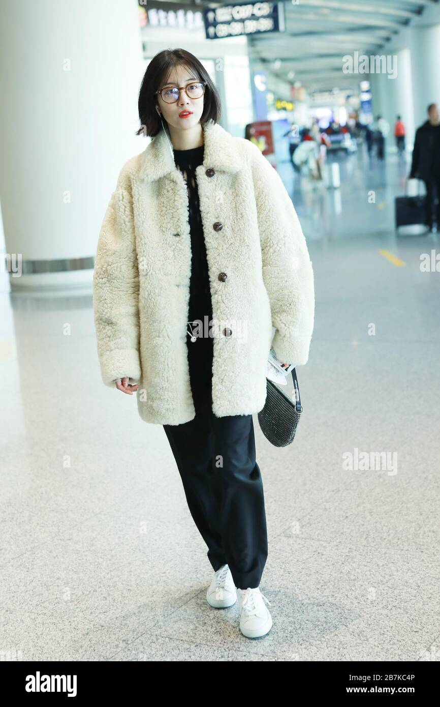 Chinese actress and singer Li Xirui arrives at Beijing airport before ...