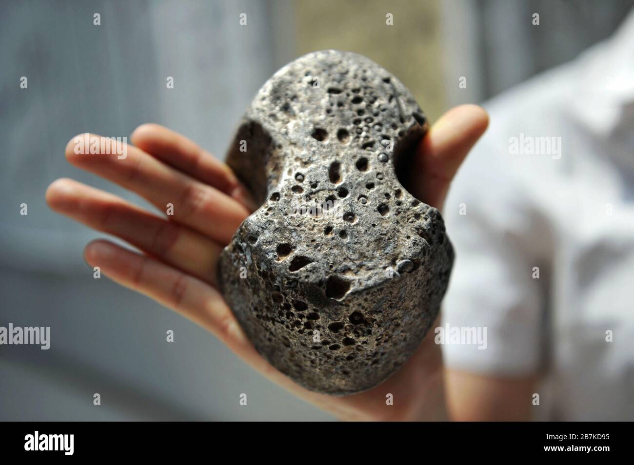 An ancient Chinese silver ingot or sycee of Ming Dynasty is on display ...