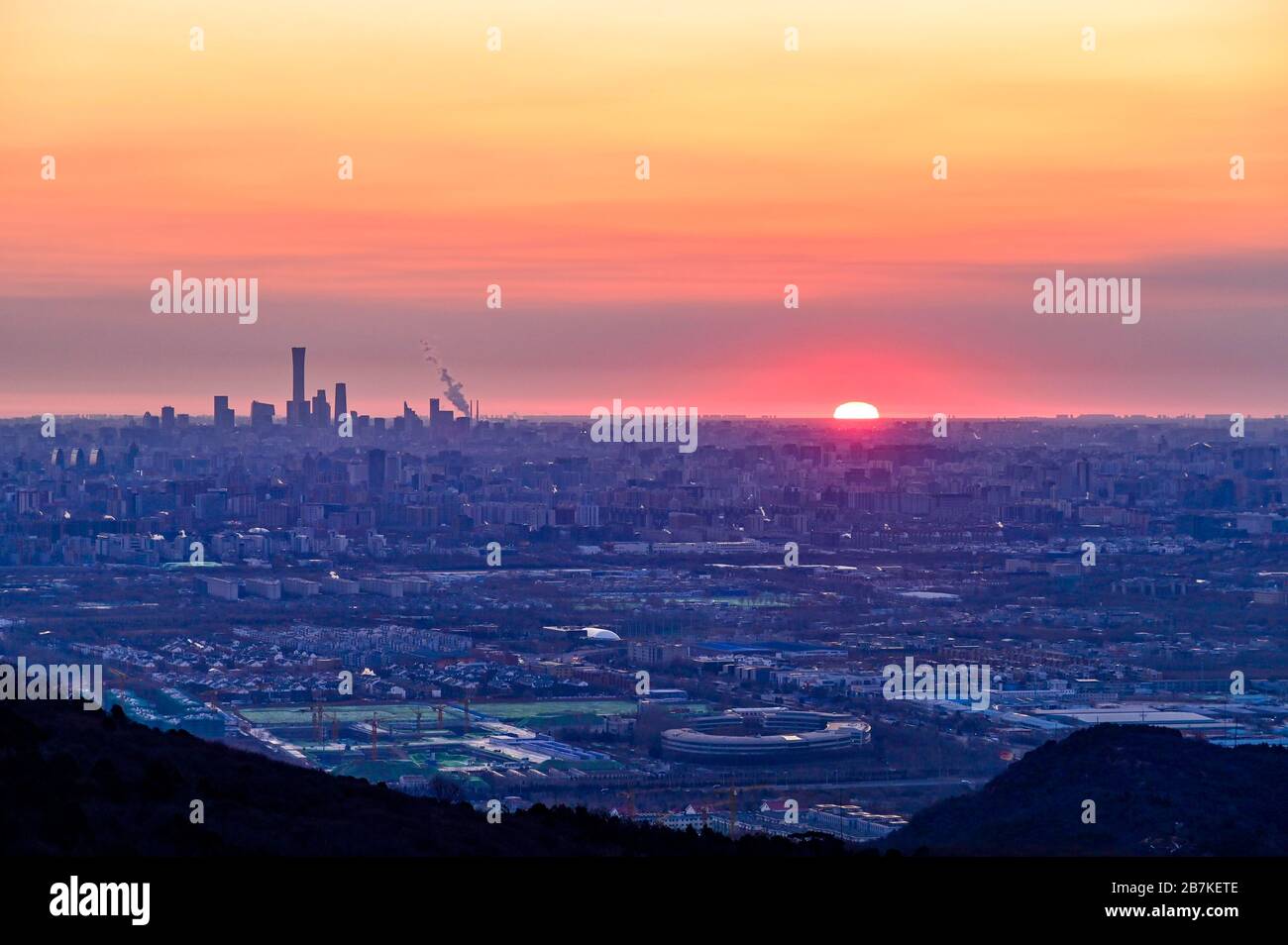 The sun is about to rise above the horizon in Beijing, China, 3 ...