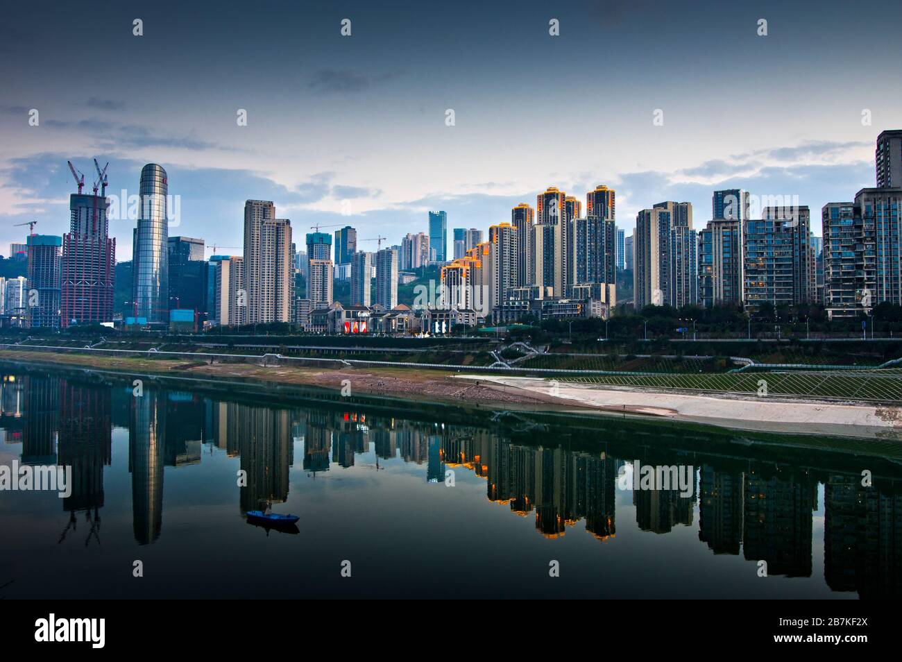 Strolling along the riverbank, a picture of the river, skyline and sky ...