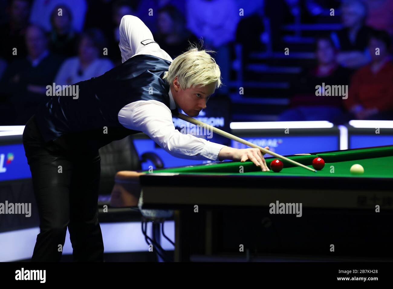 Neil Robertson of Australia plays a shot to Joe Perry of England at the ...