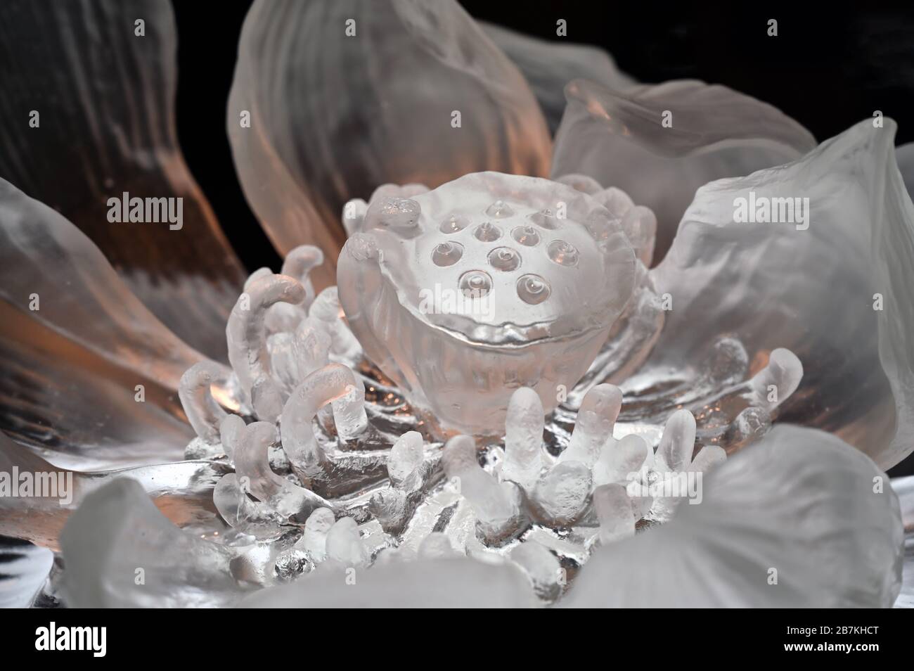 --FILE--Artworks made of liuli, colored glaze, which resemble flowers ...