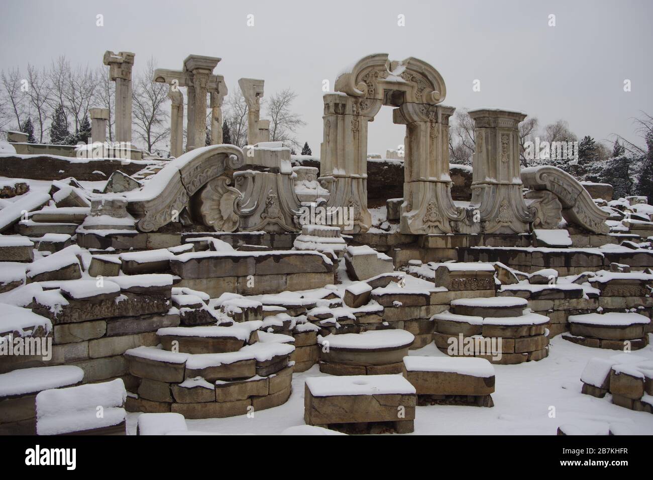 The snow covers debris of the Old Summer Palace, known in Chinese as ...