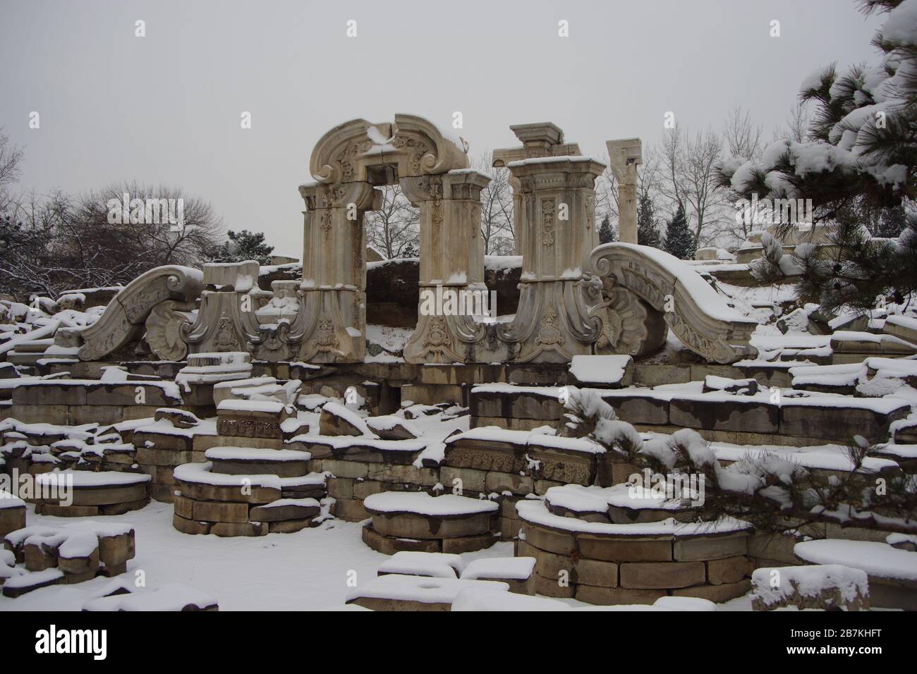 The snow covers debris of the Old Summer Palace, known in Chinese as ...