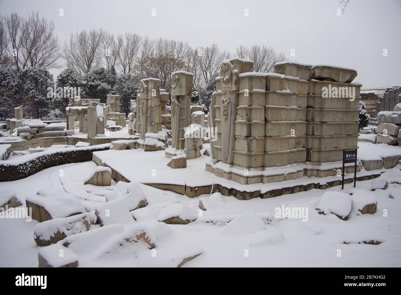 The snow covers debris of the Old Summer Palace, known in Chinese as ...