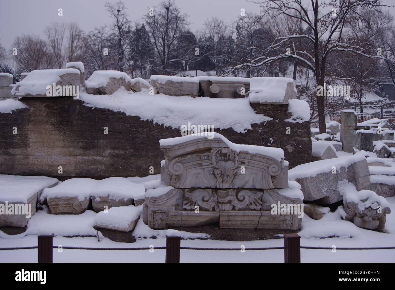 The snow covers debris of the Old Summer Palace, known in Chinese as ...