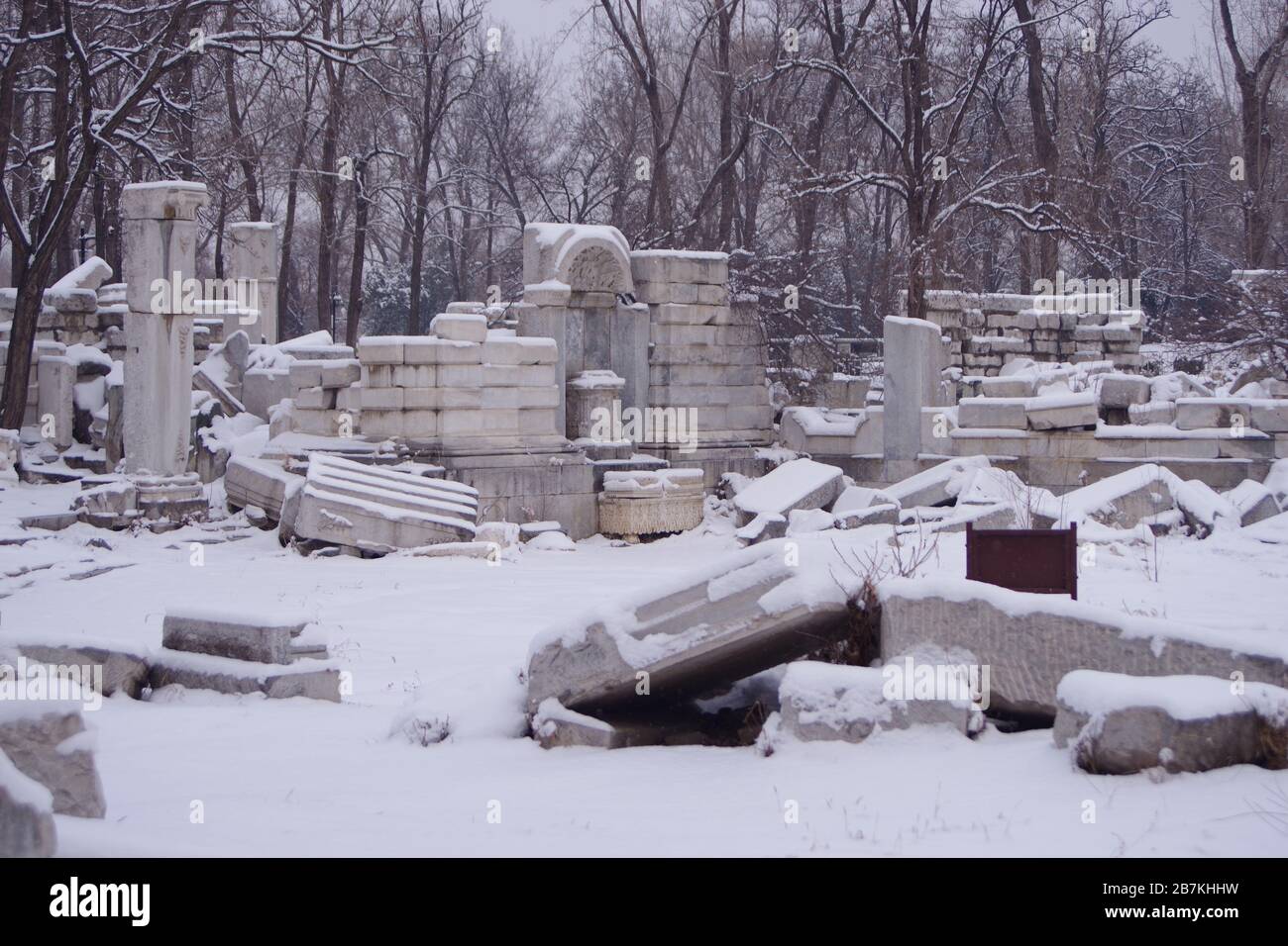 The snow covers debris of the Old Summer Palace, known in Chinese as ...