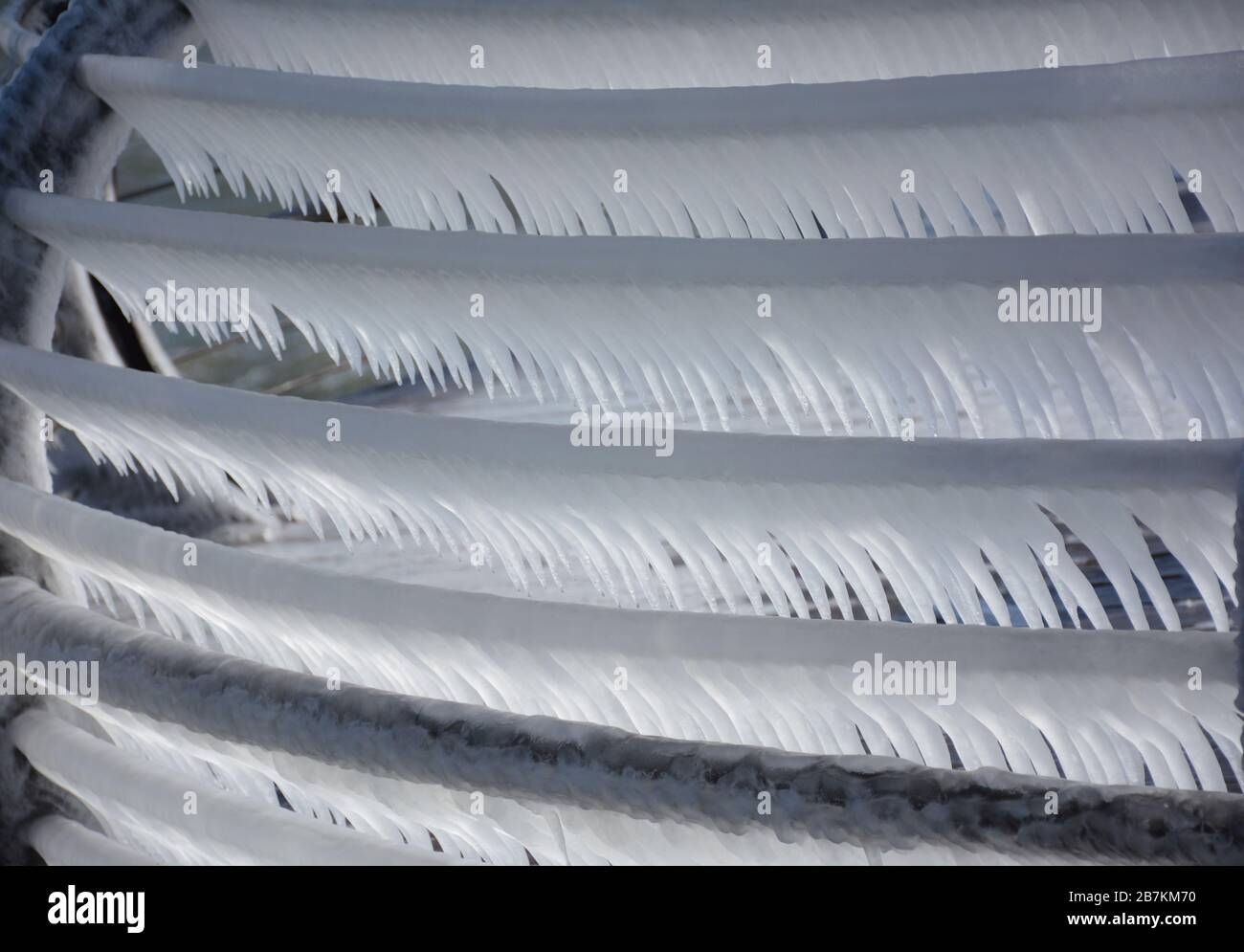 Due to gale and low temperature, ice appears and is hung at handrail at ...