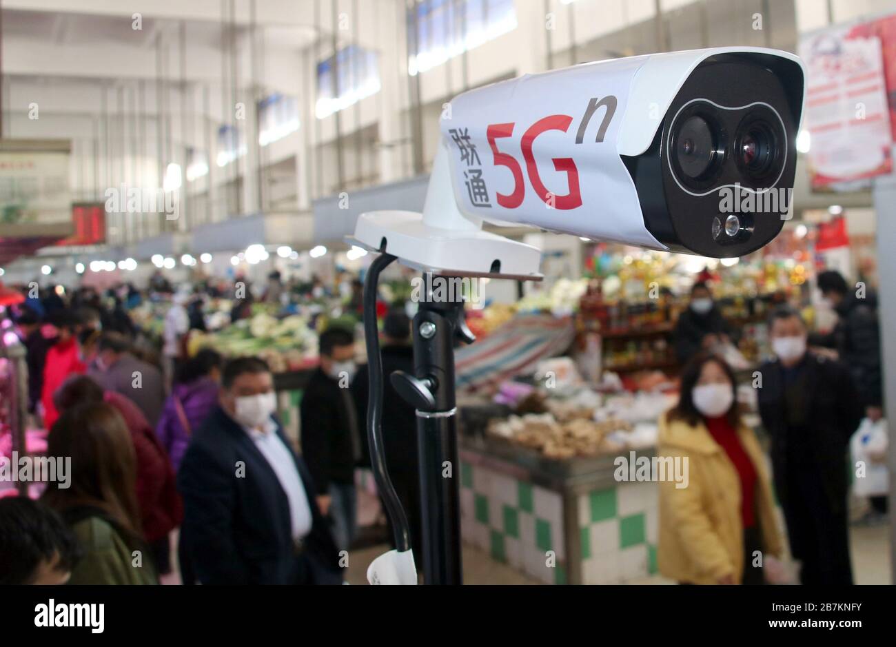 A 5G imaging temperature check camera is installed at a farmers' market ...
